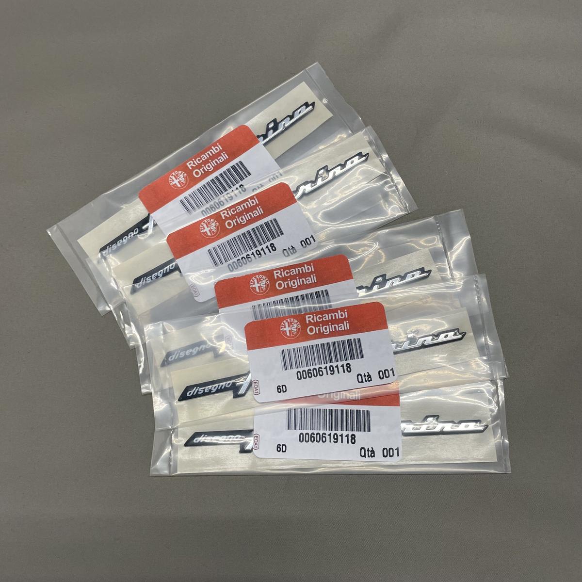 "disegno Pininfarina" script emblem for Alfarom...